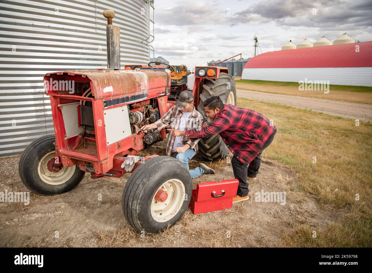 Boy fixing tractor hi-res stock photography and images - Alamy Boy fixing tractor hi-res stock photography and images - Alamy