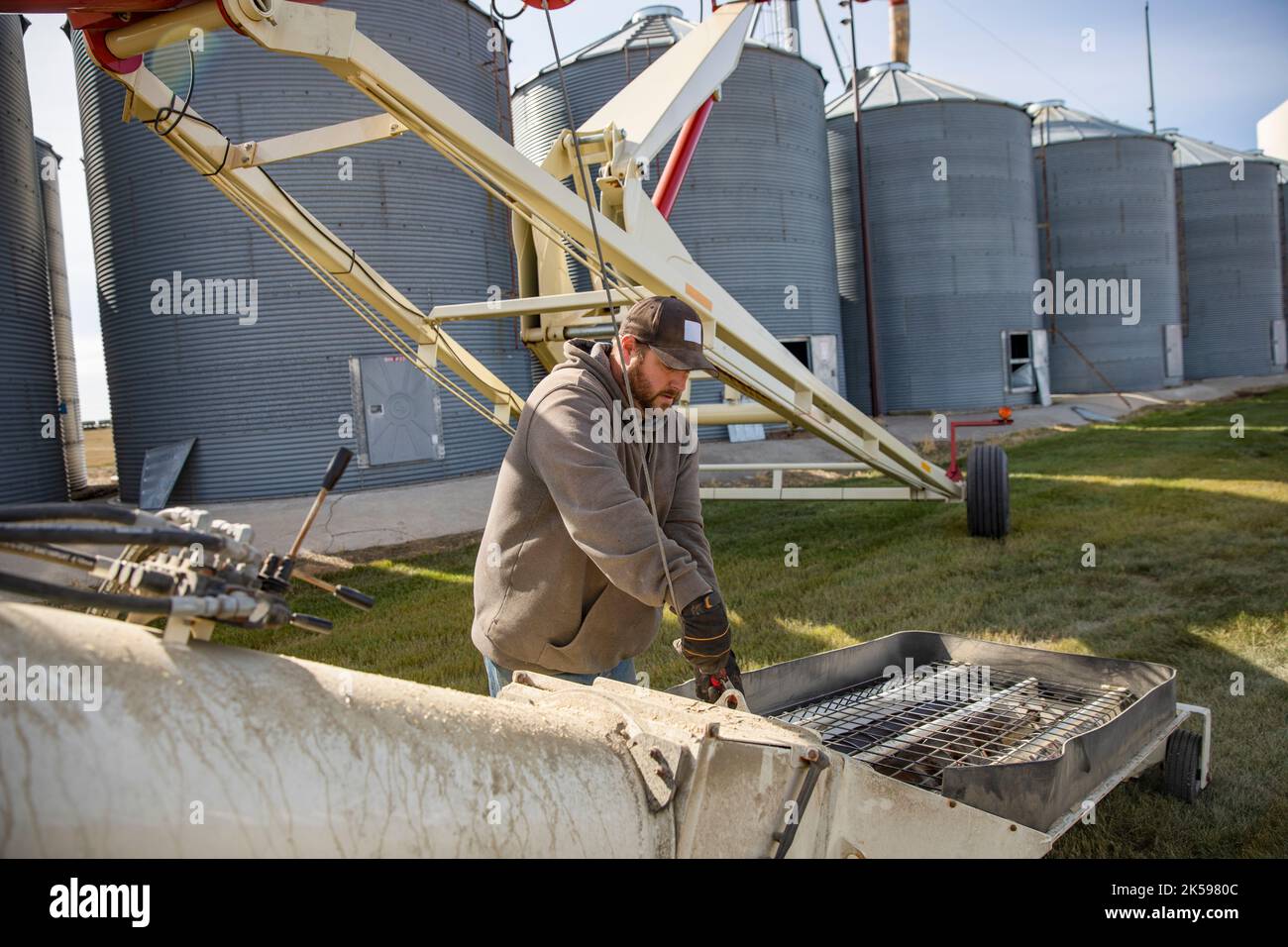 Male farmer operating equipment hi-res stock photography and images - Alamy