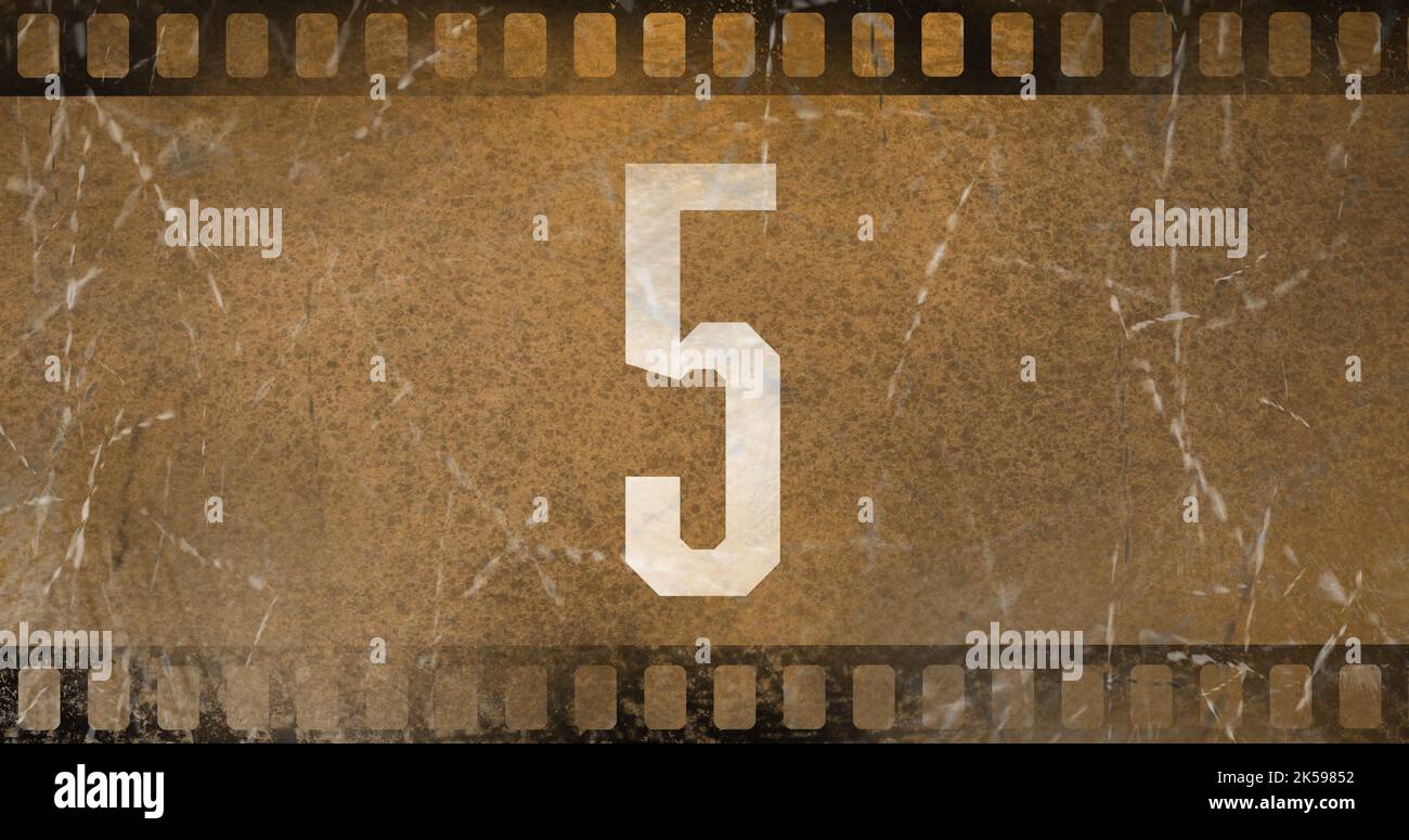 Composite of white colored number 5 text on old negative camera film ...