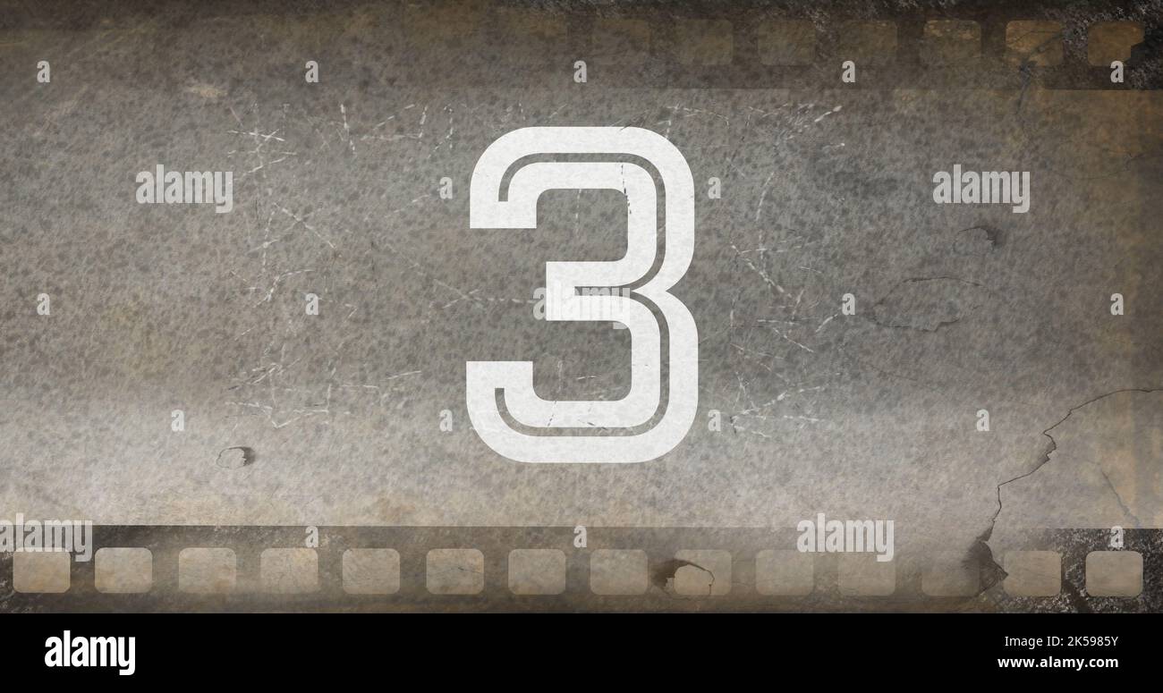 Composite of white colored number 3 text on old gray negative camera ...