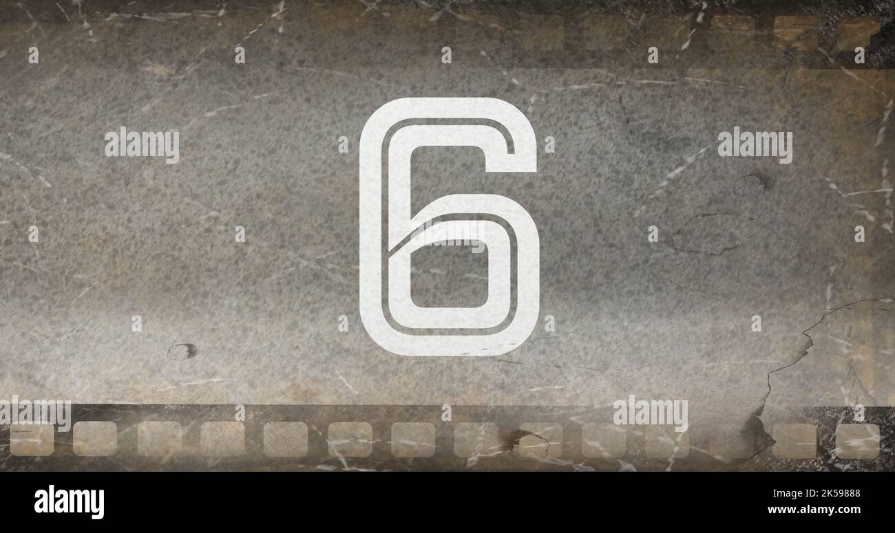 Composite of white colored number 6 text on old gray negative camera ...