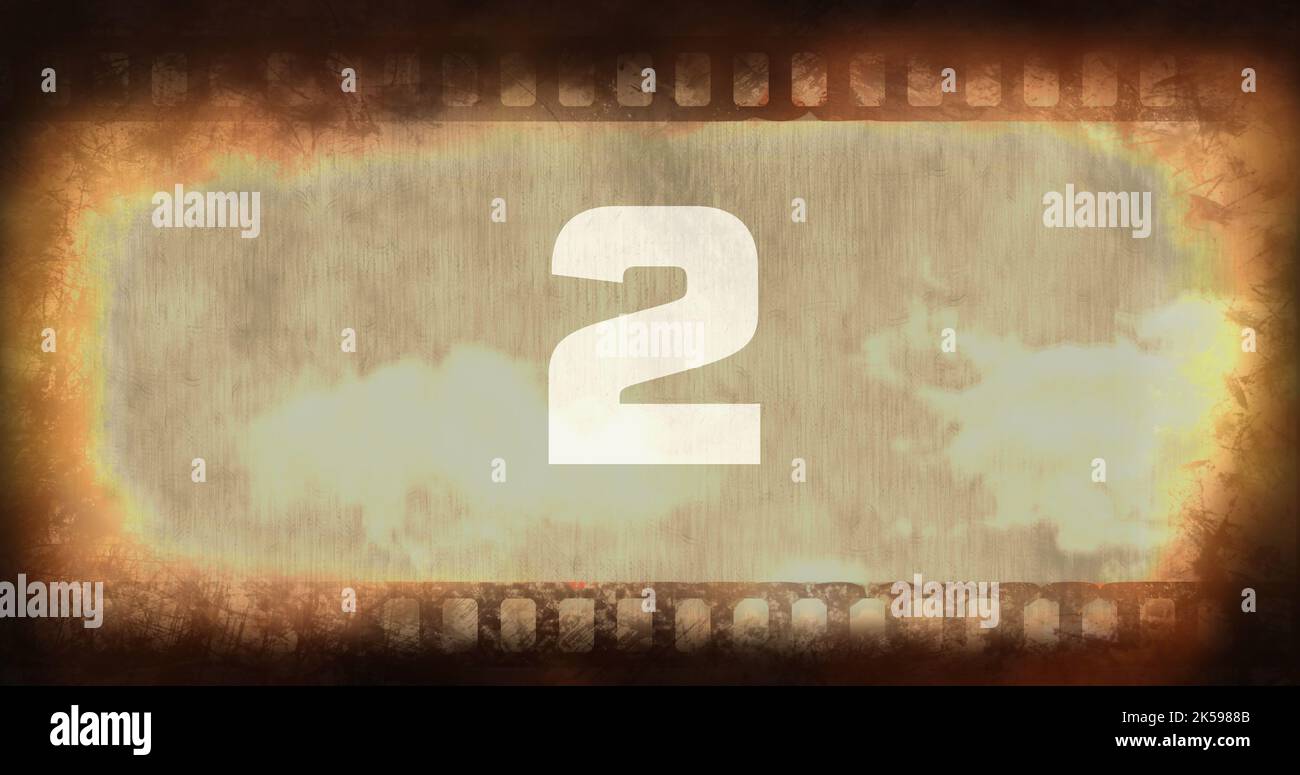 Composite of number 2 text over old rusty negative camera film with ...