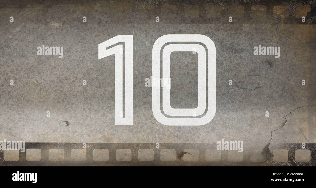 Composite of white colored number 10 text on old gray negative camera ...