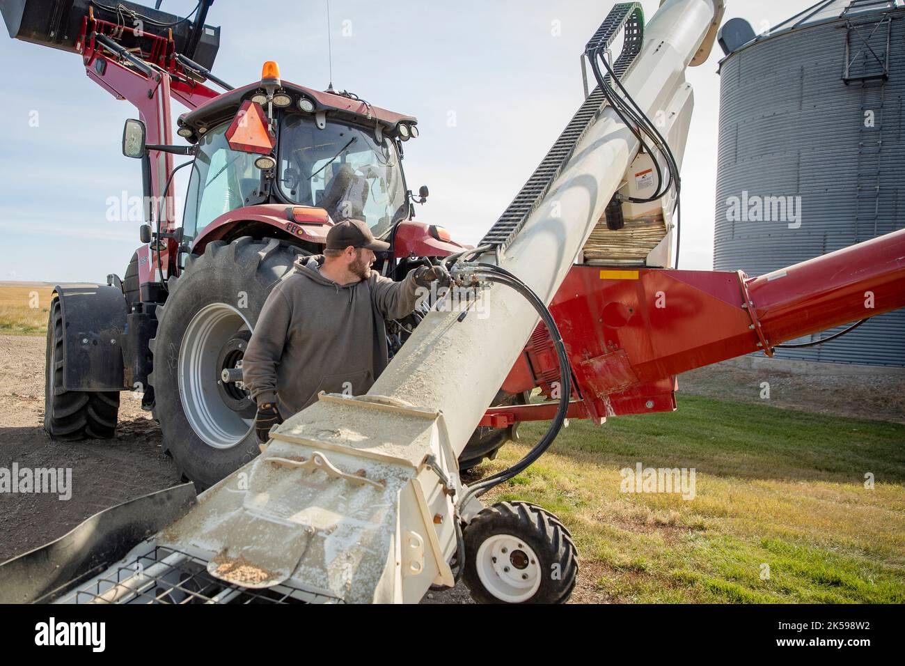 Male farmer operating equipment hi-res stock photography and images - Alamy