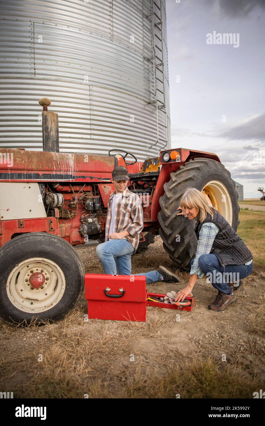 Boy fixing tractor hi-res stock photography and images - Alamy