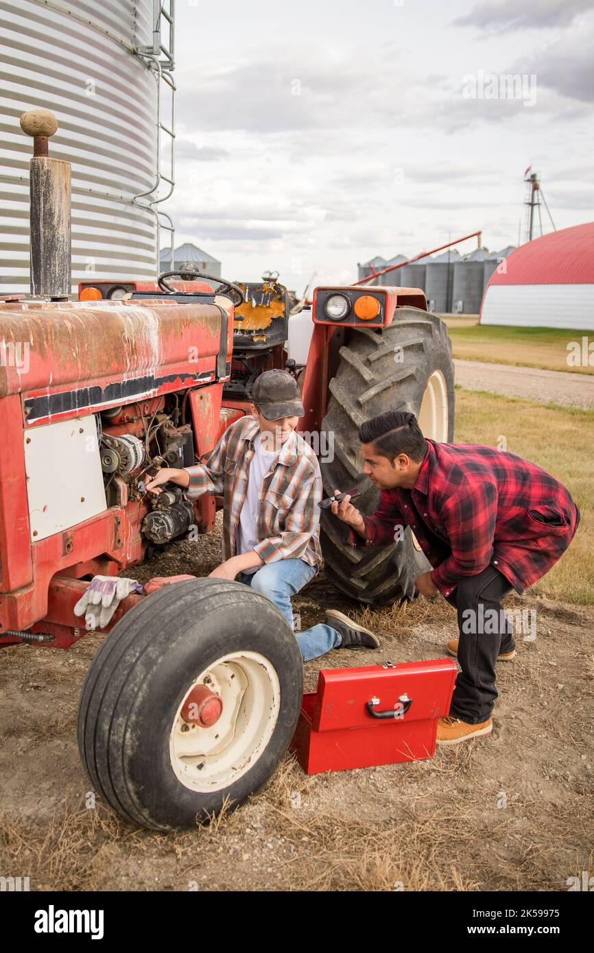 Boy fixing tractor hi-res stock photography and images - Alamy