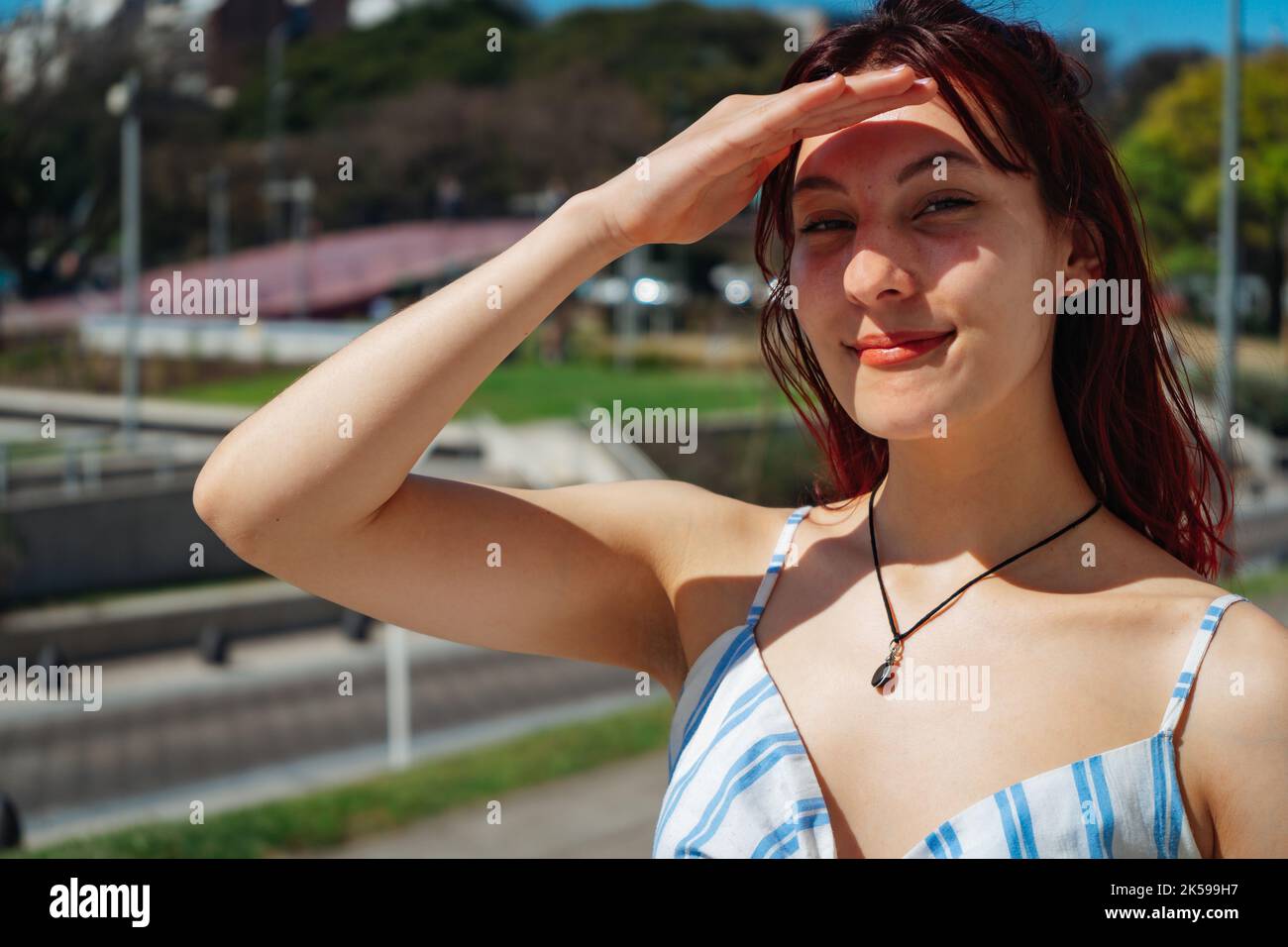 Close Up Of A Beautiful Smiling Young Latina Redhead Covering Her Eyes