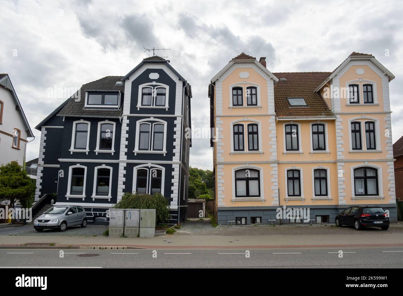 29.08.2022, Germany, Lower Saxony, Emden - Twin old buildings leaning ...