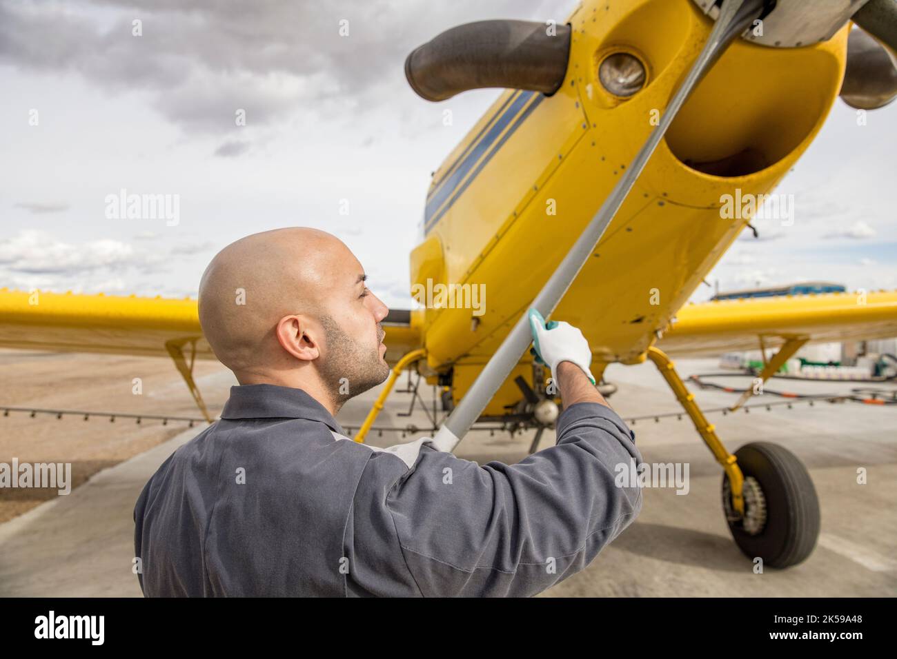 Examining crop sprayer on runway hi-res stock photography and images ...