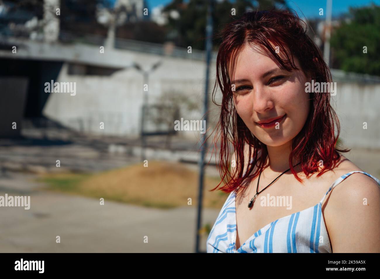 Portrait of a young redheaded woman. She slight smile. copyspace Stock ...