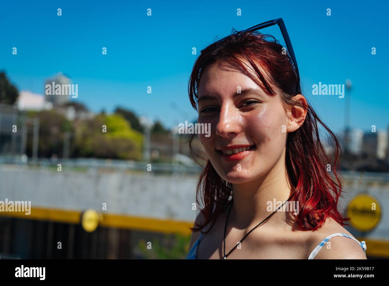 A Portrait of attractive red-haired young woman smiling. Copy space ...