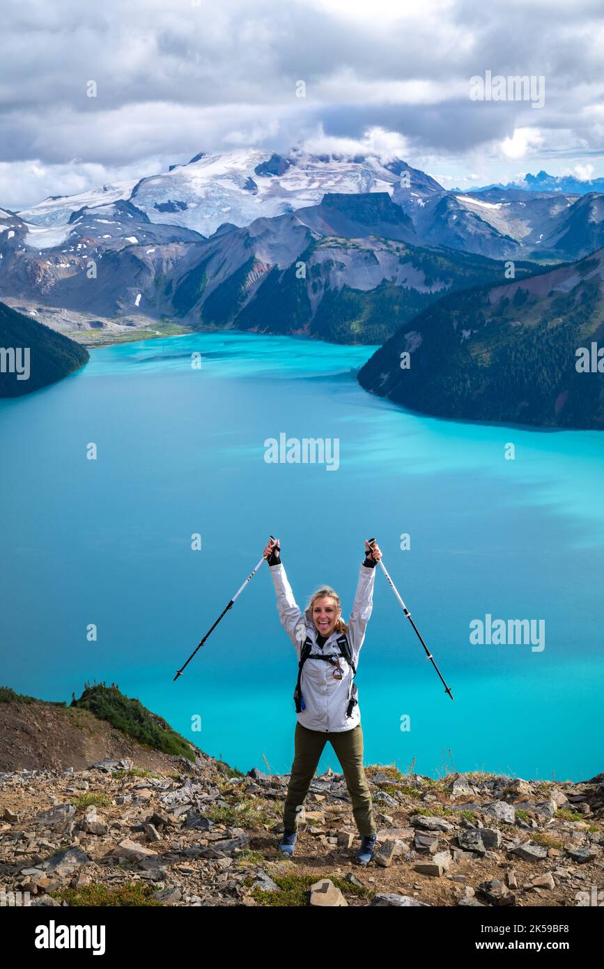 Hiker celebrates on Panorama Ridge with a stunning backdrop Stock Photo ...