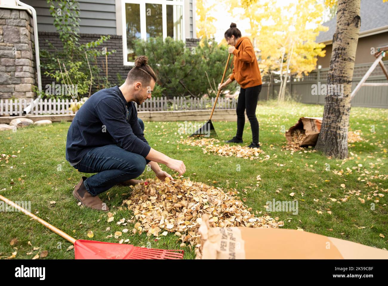 Sweeping autumn leaves hi-res stock photography and images - Alamy