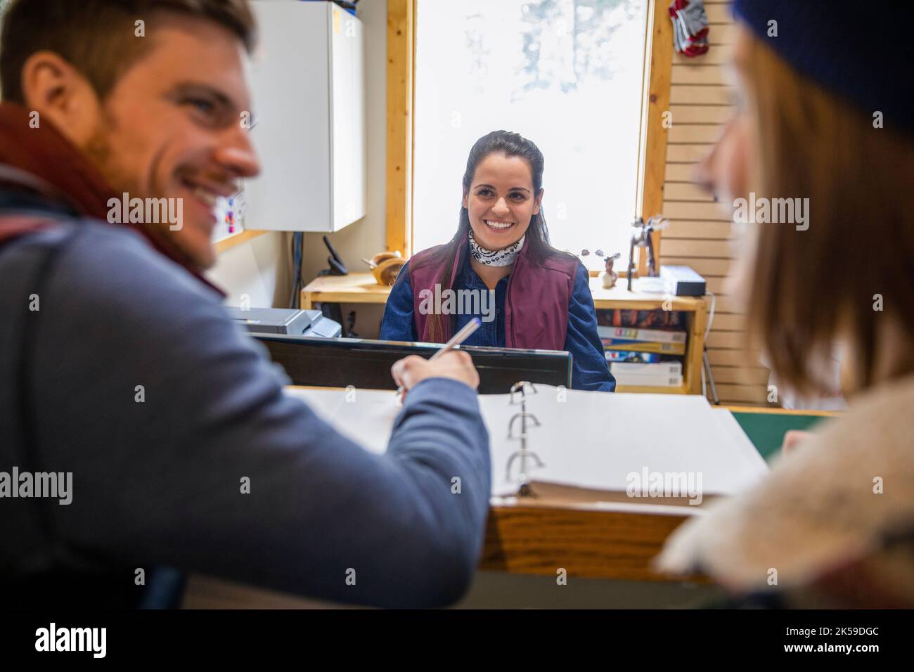 Female hotel employee helping guest hi-res stock photography and images ...
