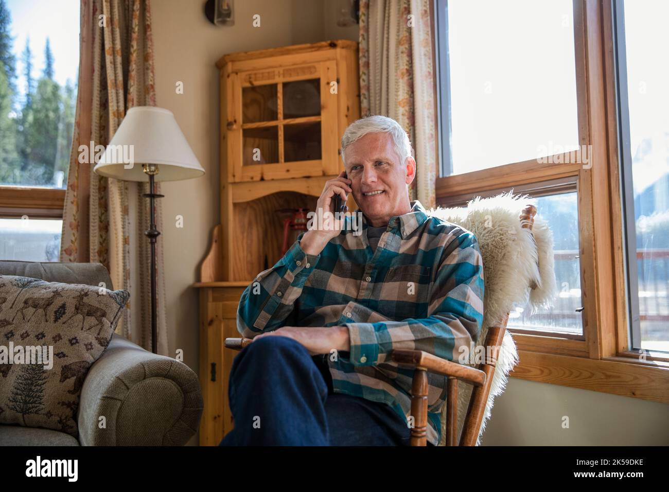 Man sitting on chair legs hi-res stock photography and images - Alamy