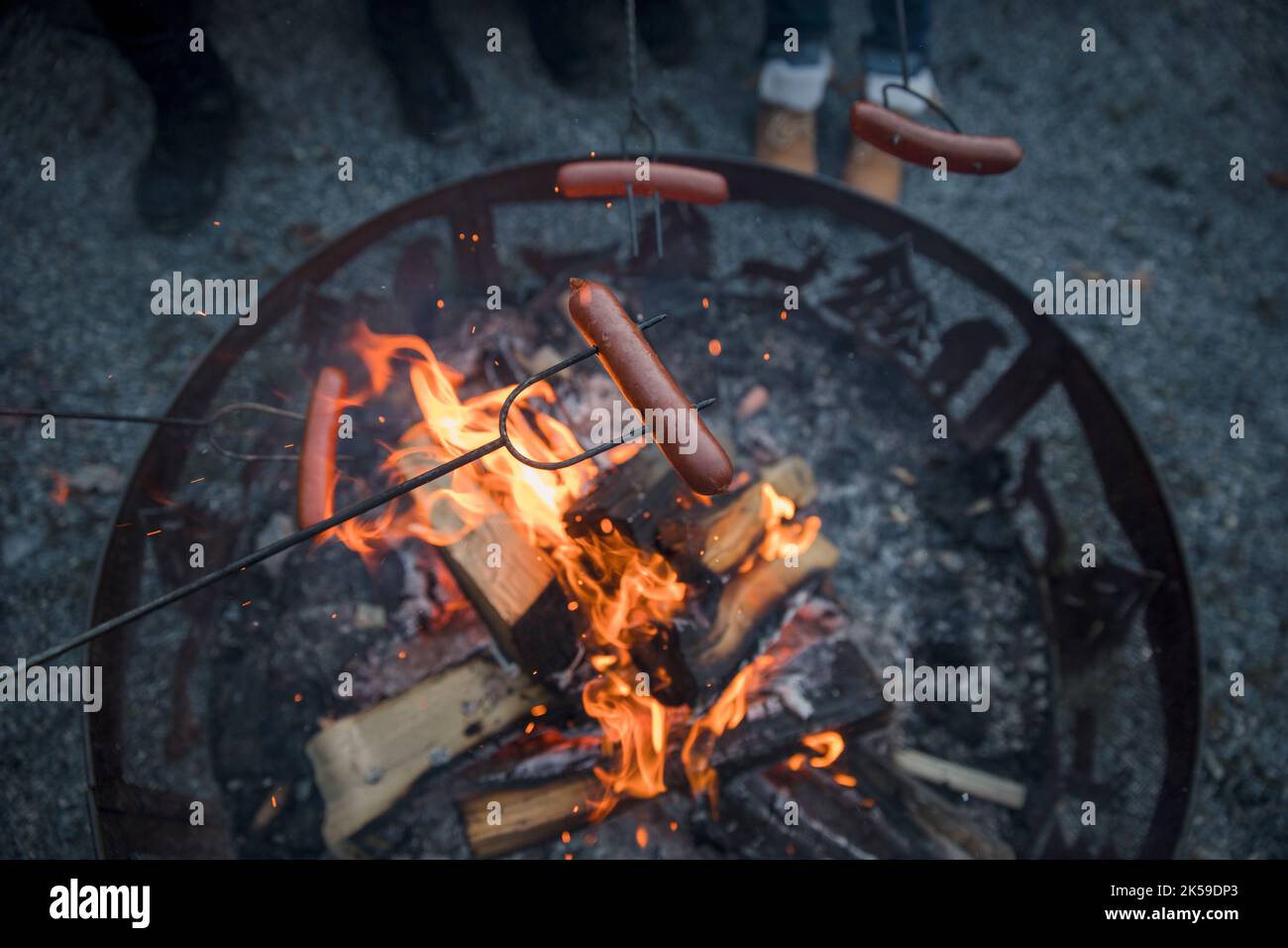 Cooking hot dogs over a campfire hi-res stock photography and images ...