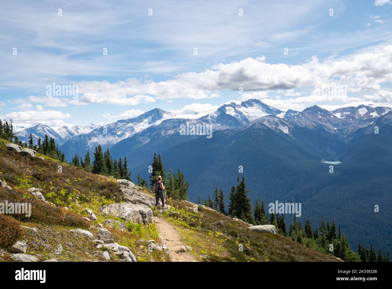 Solo hiker on High Note Trail with a backdrop of Whistler's majestic ...