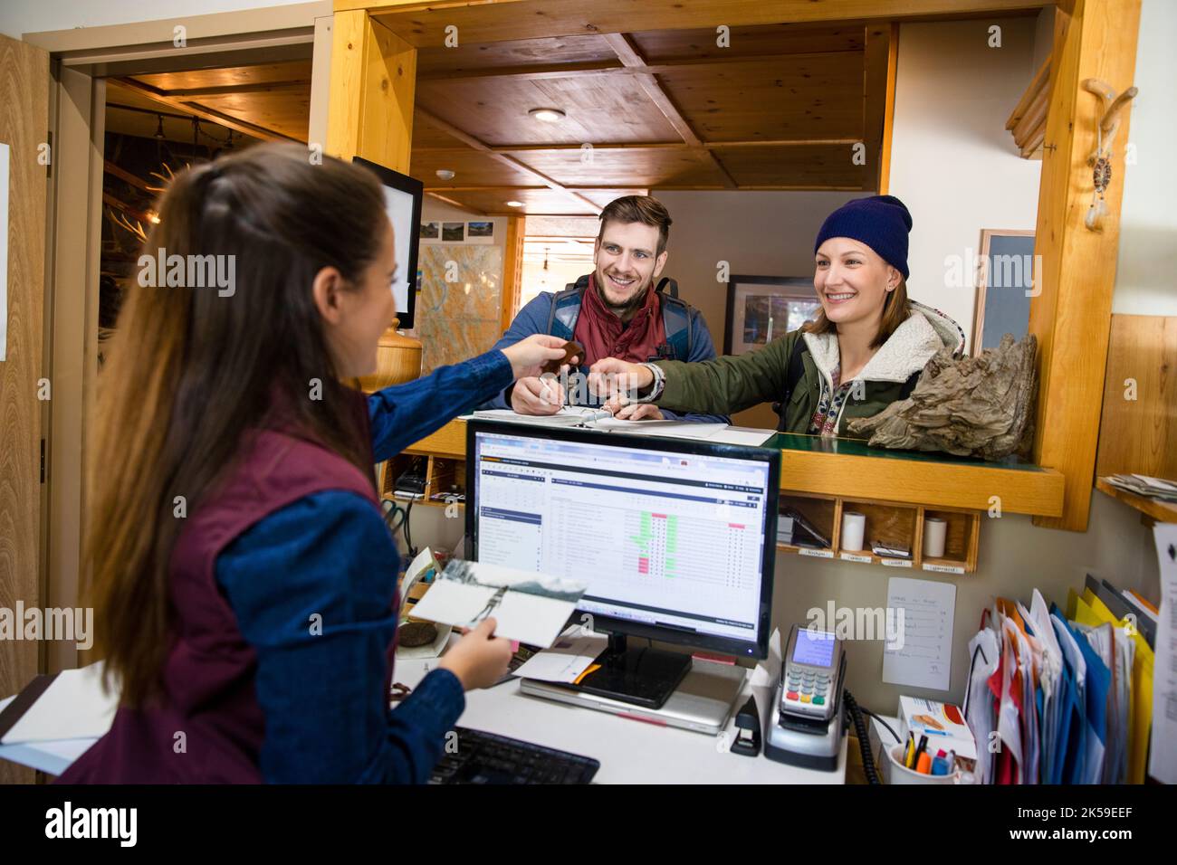 Female hotel employee helping guest hi-res stock photography and images ...