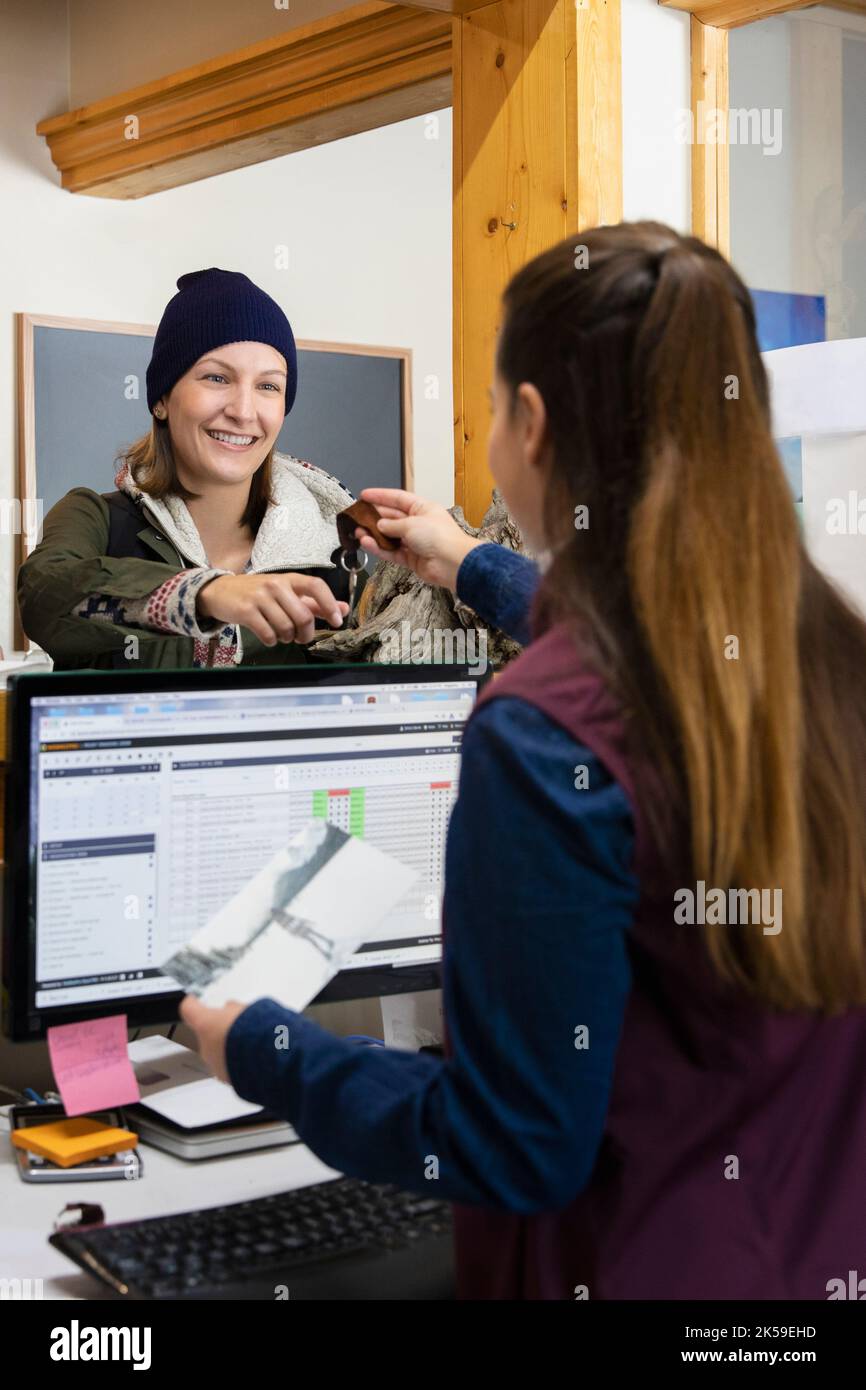 Female hotel employee helping guest hi-res stock photography and images ...