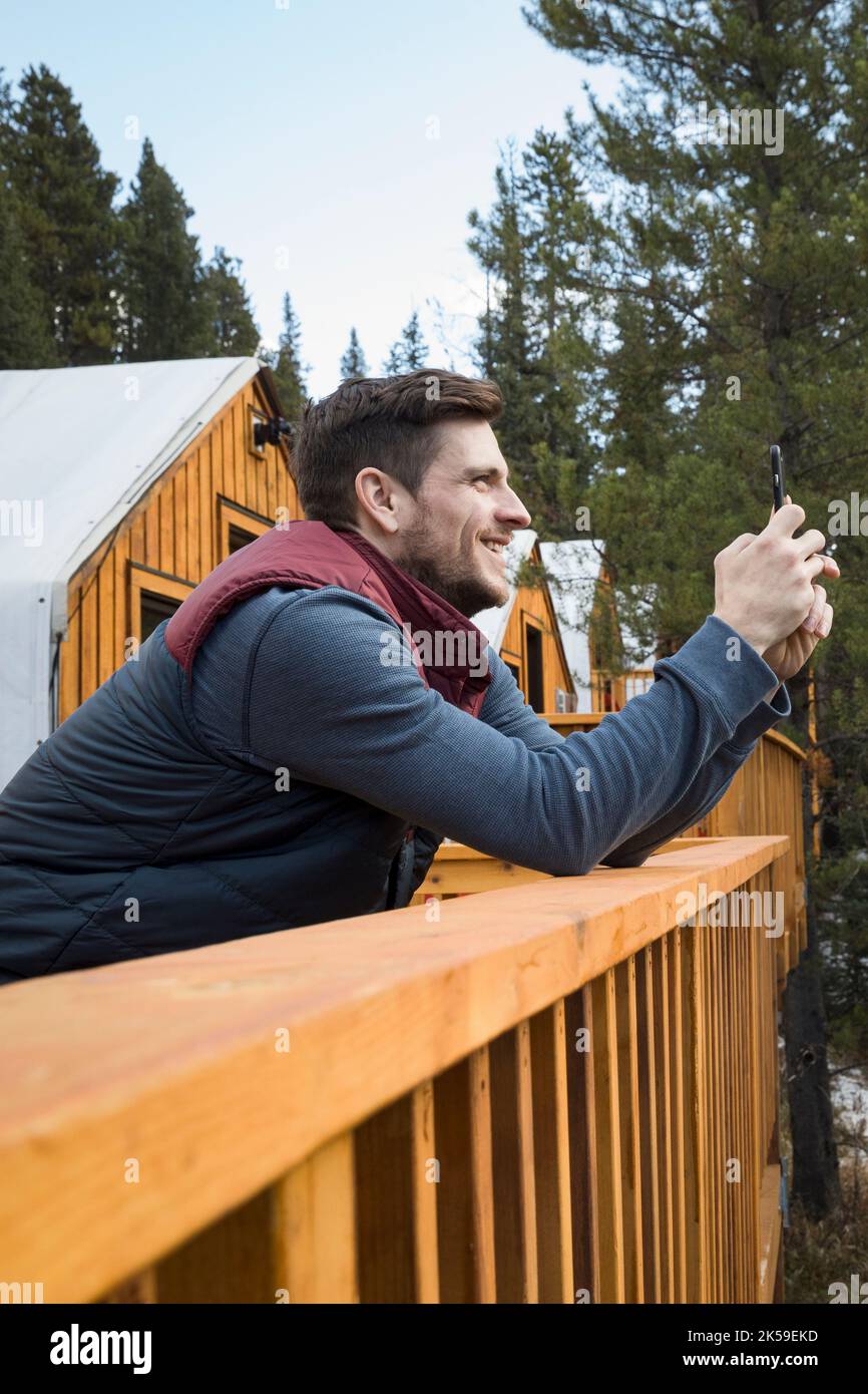 Man leaning on balcony railing hi-res stock photography and images - Alamy