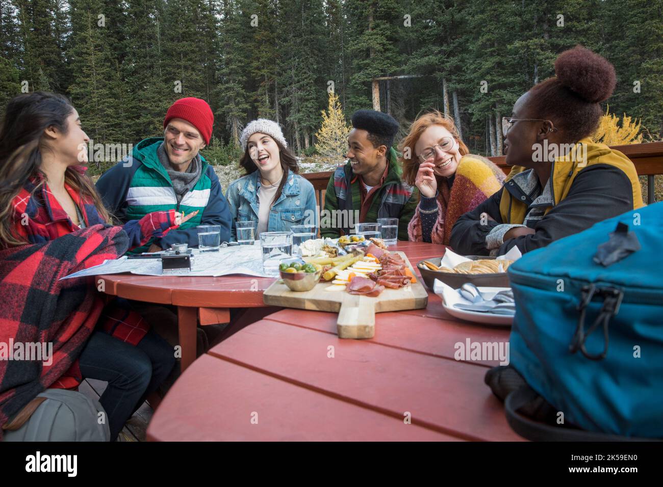 Friends talking and laughing in cabin hi-res stock photography and ...