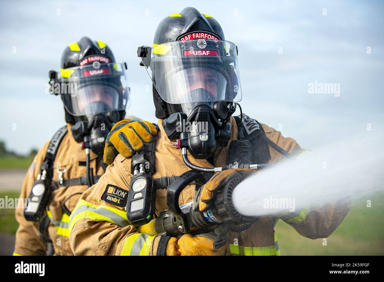 Firefighters from the 422d Fire Emergency Services extinguish an ...