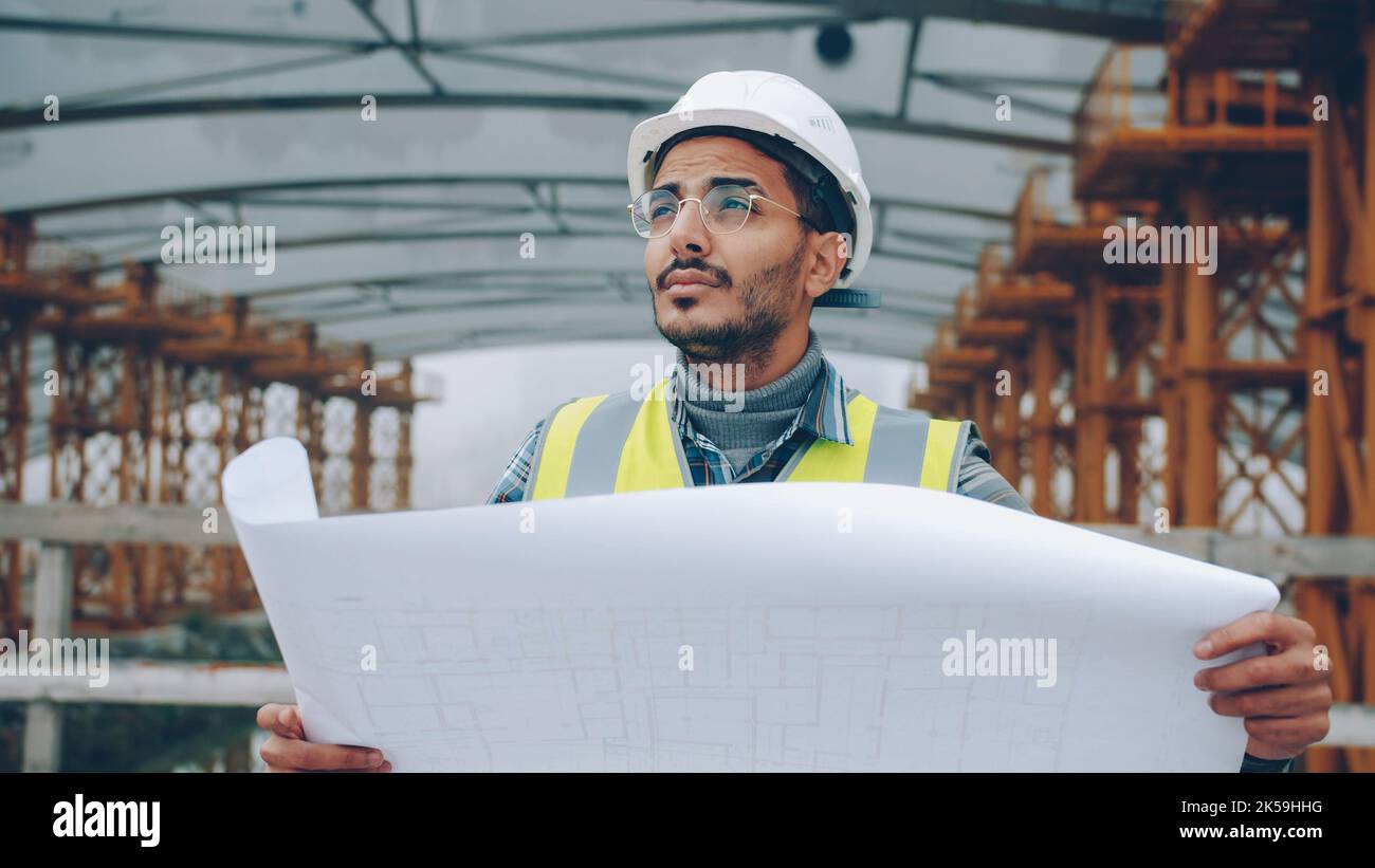 Portrait of Middle Eastern construction employee wearing uniform ...
