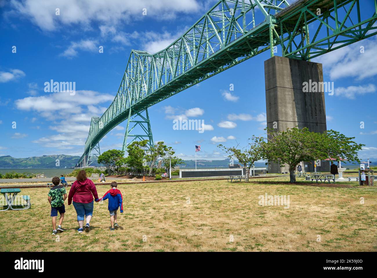Mother and boys walk towards the Astoria-Megler Bridge on the Columbia ...