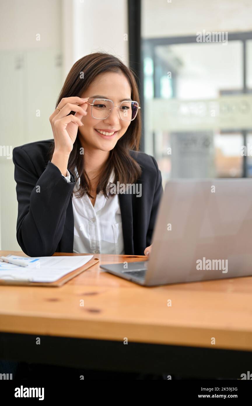 Smart and beautiful millennial Asian female accountant or executive ...