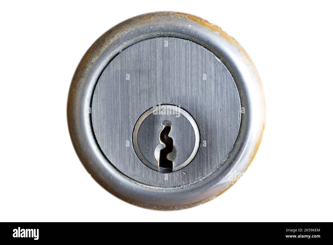 Metal key plate with keyhole of a cylinder lock in a door. Isolated on ...