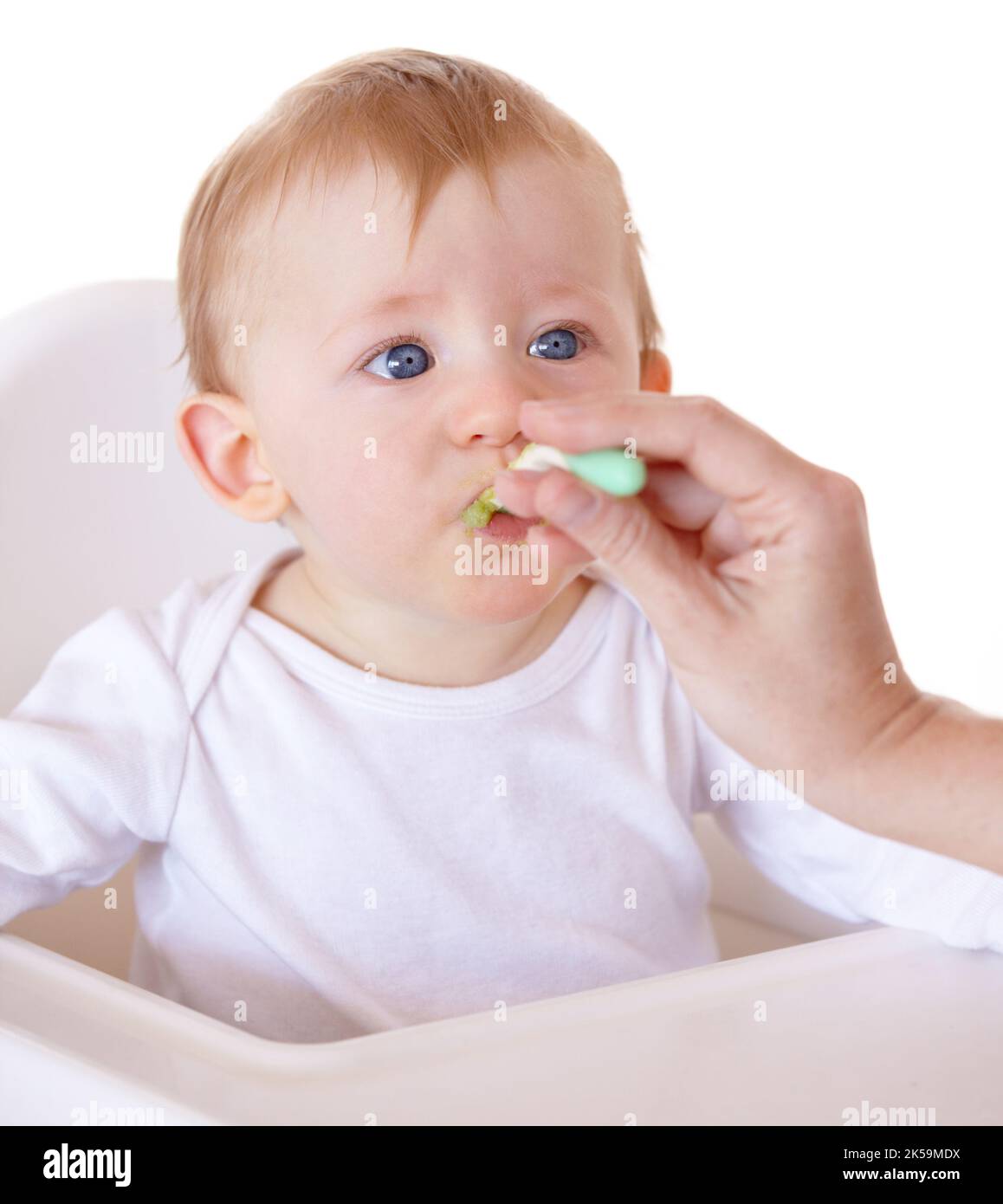 Eating the food mommy provides. A cute baby being fed a spoonful of ...