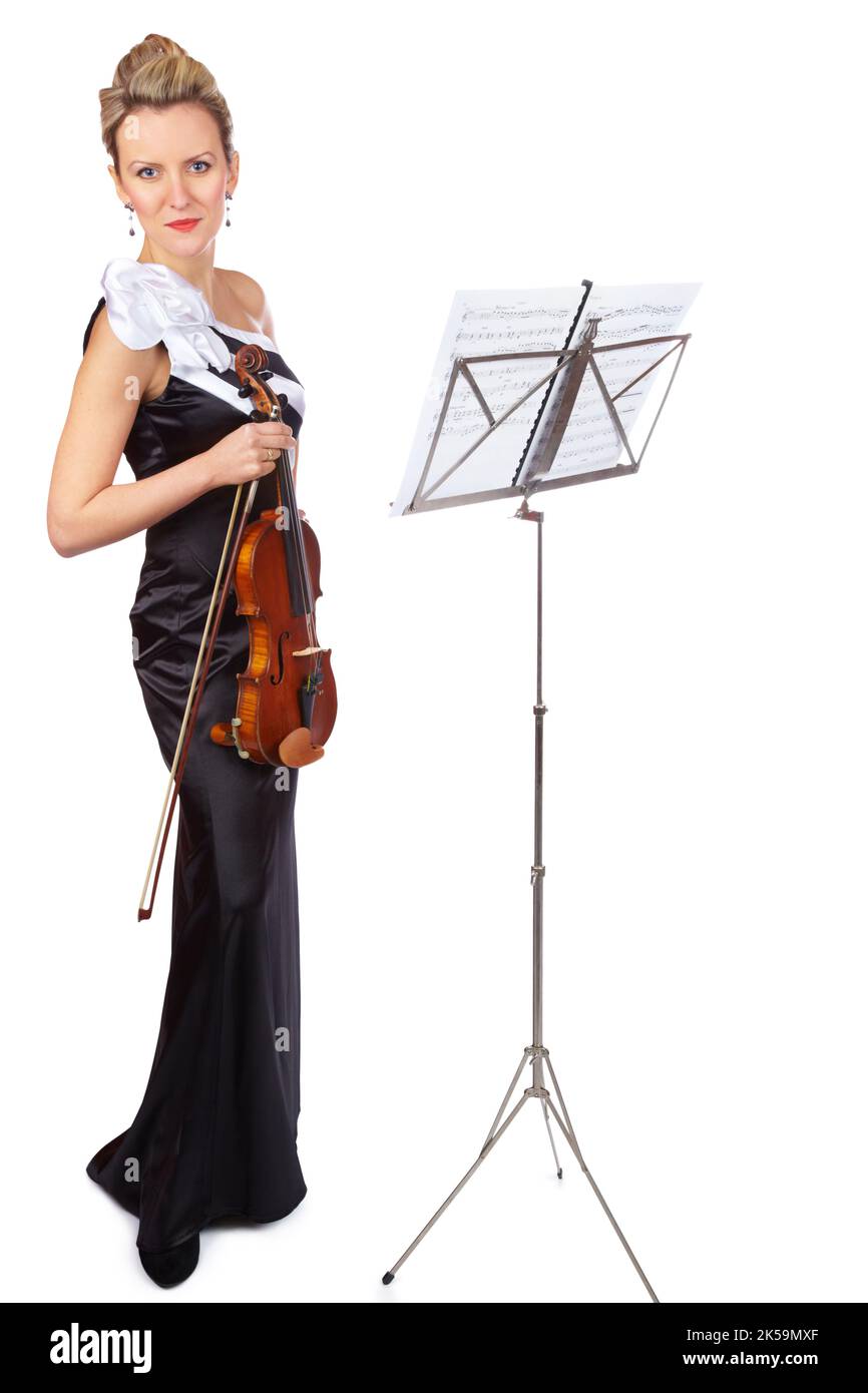 Music is her life. A gorgeous violinist standing in front of a sheet ...