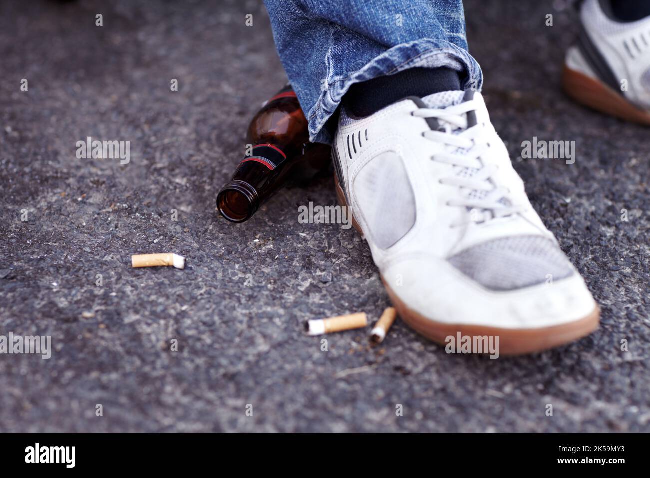 Going off the rails. Closeup shot of a person standing next to ...