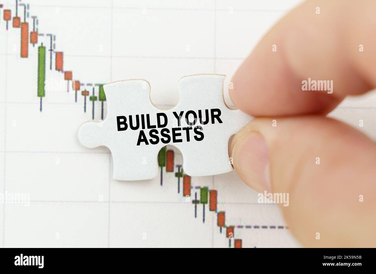 Business concept. Against the background of the quotes chart, a puzzle ...