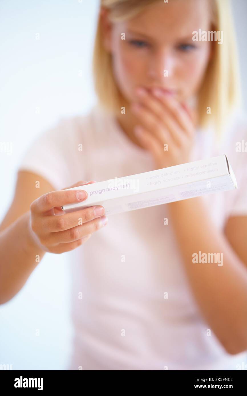 Maybe its a false alarm. A young woman looking anxious about taking a ...