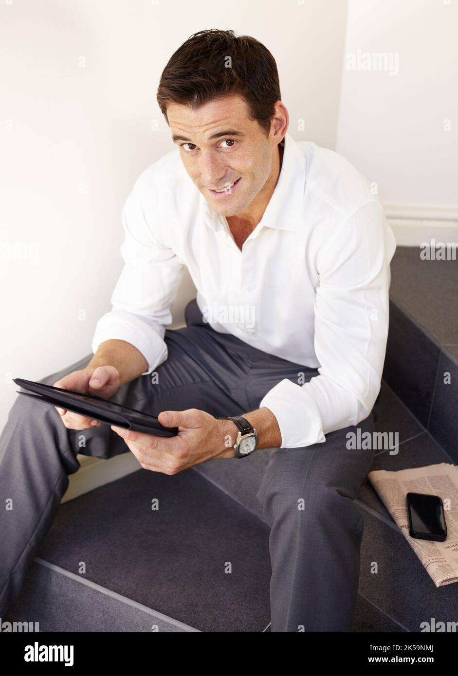 Using technology to increase business output. Portrait of a handsome ...