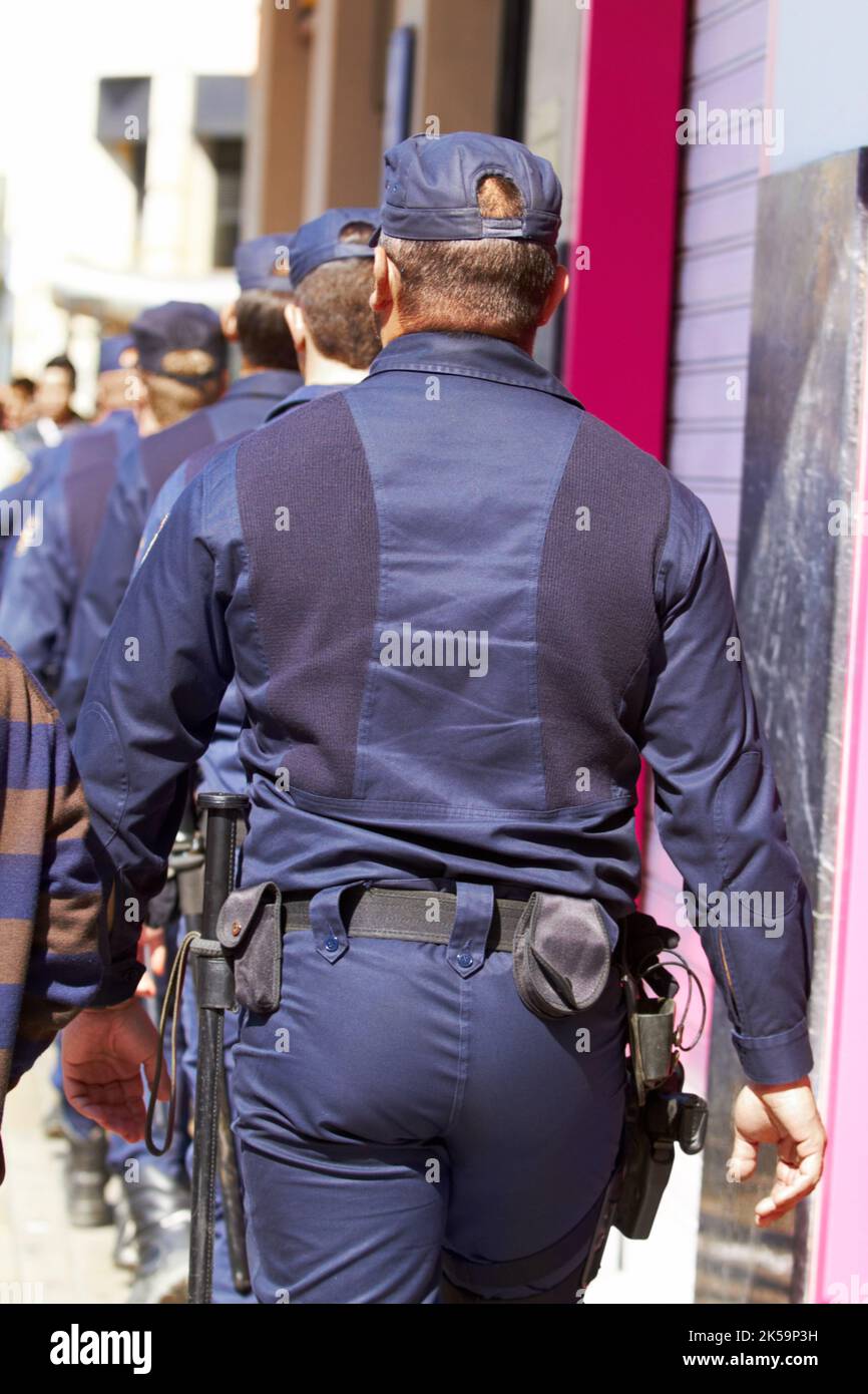 Police officers walk on street hi-res stock photography and images - Alamy