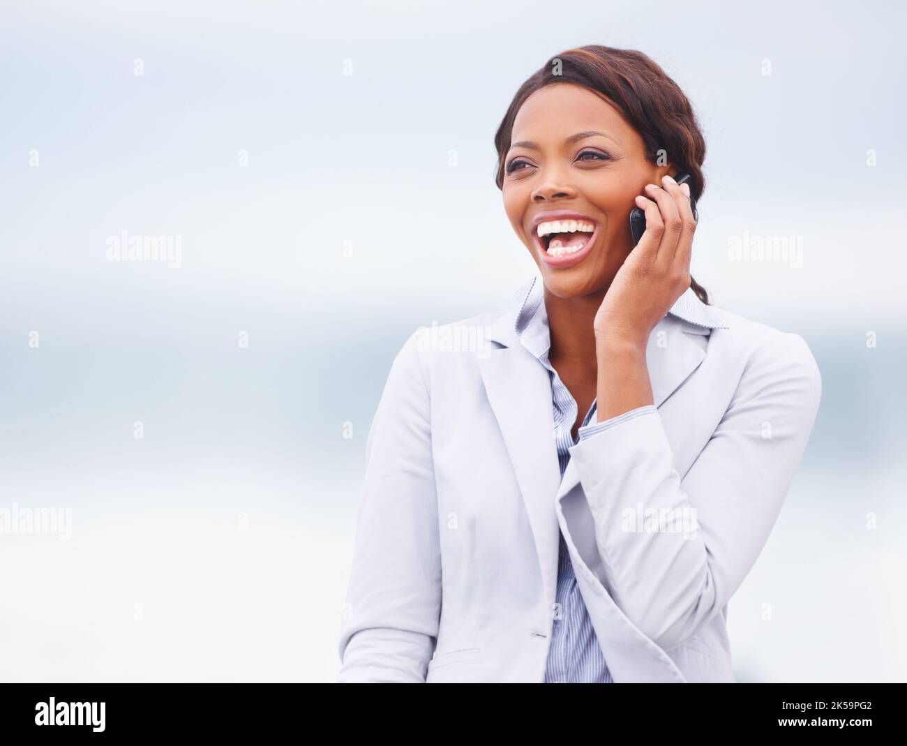 Connected wherever and whenever. A pretty african american woman having ...