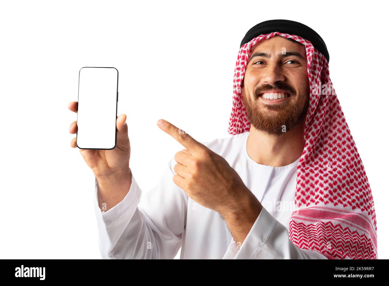 Young Arab muslim man in traditional clothes showing mobile phone ...