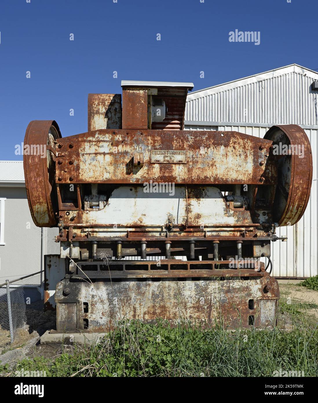 Old sheet steel bending machine outside old factory in Inverell, new ...