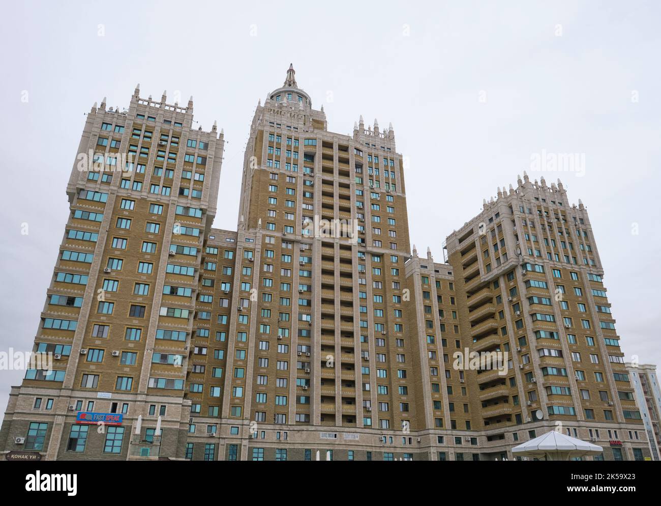 Cloudy, grey view of the looming, iconic Triumph Towers, modeled after ...
