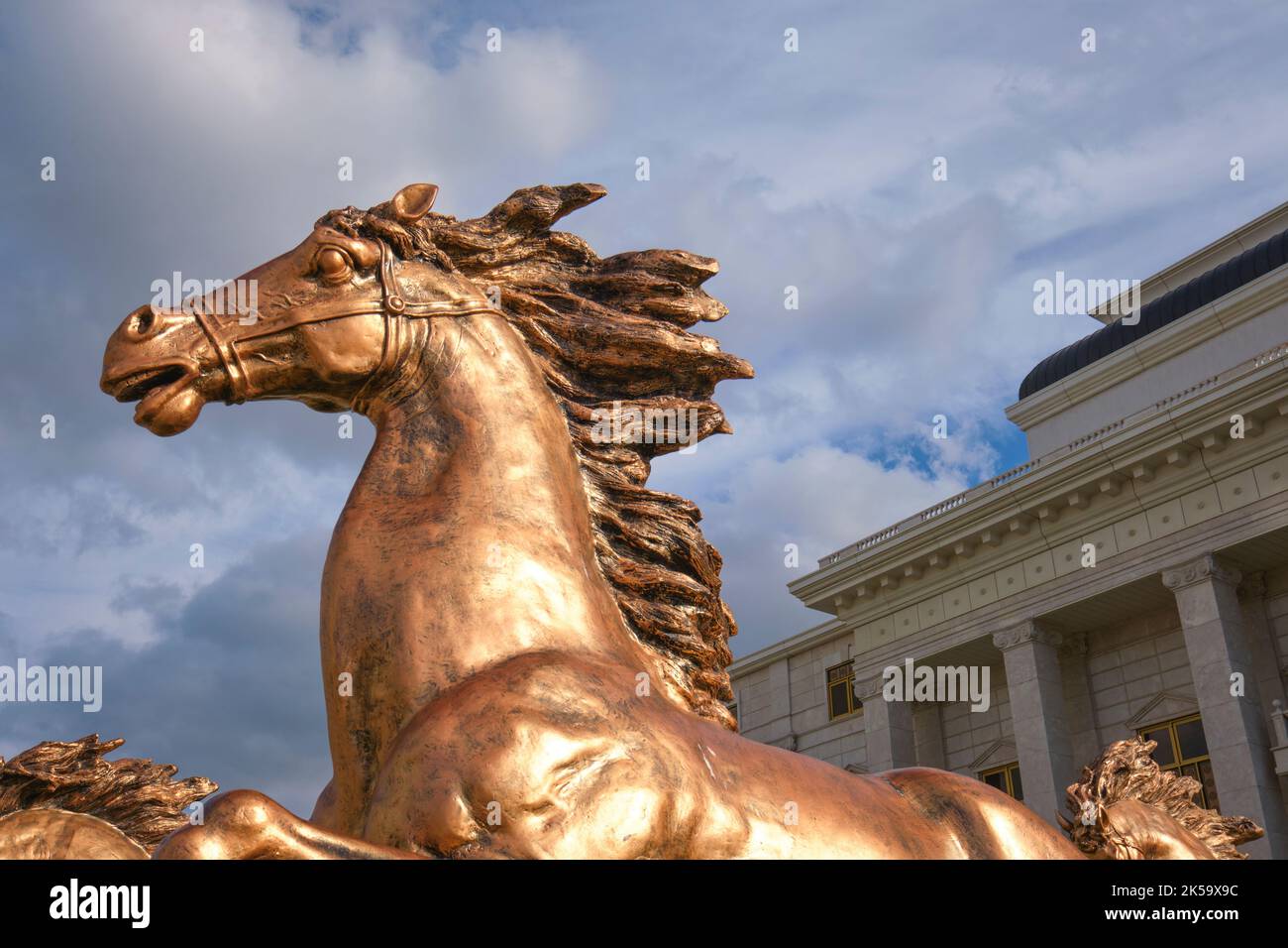Lifesize, shiny bronze horse sculptures behind the Astana Opera and ...