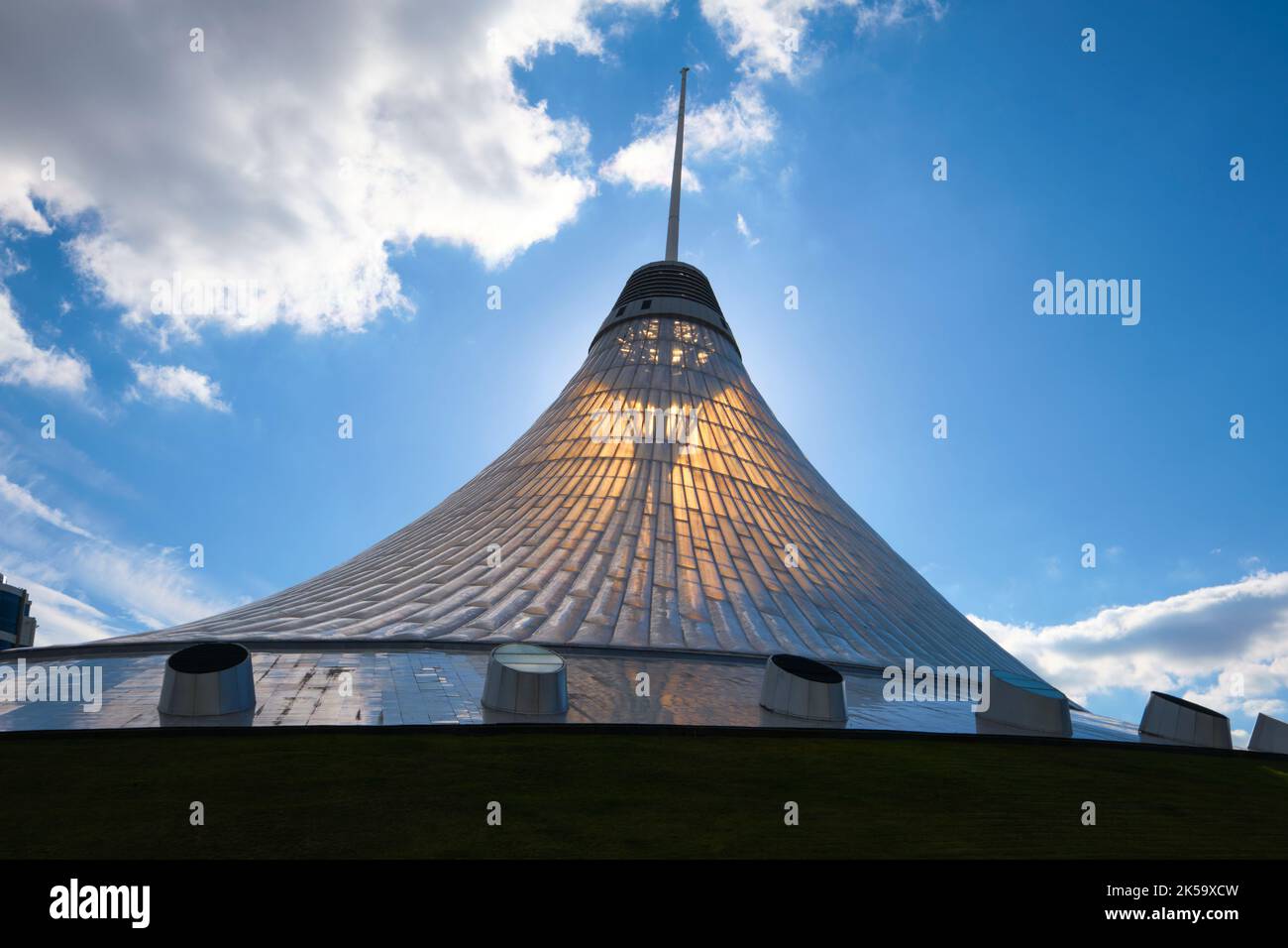 A backlit, exterior view of the Norman Foster design of the tent-like ...
