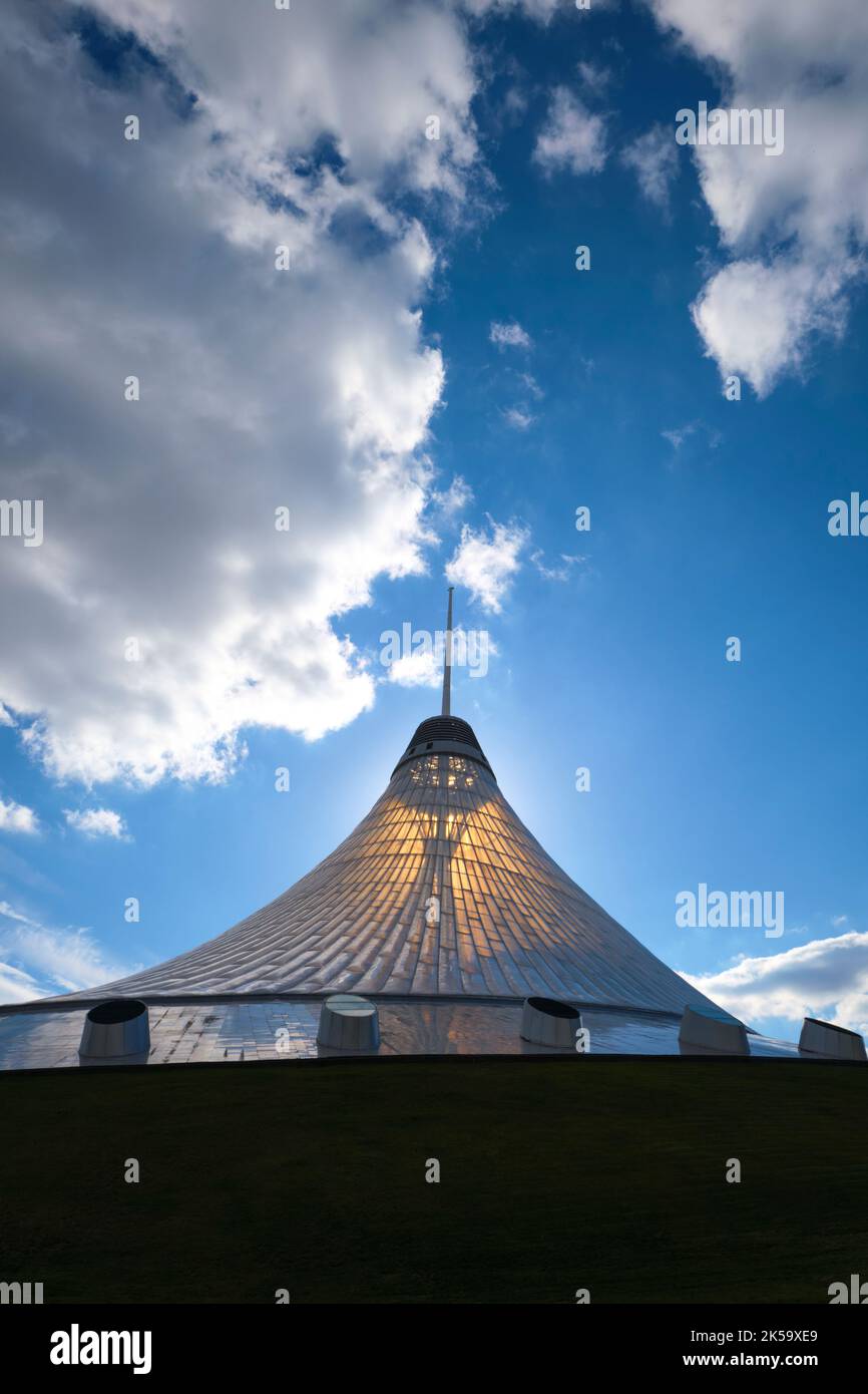A backlit, exterior view of the Norman Foster design of the tent-like ...