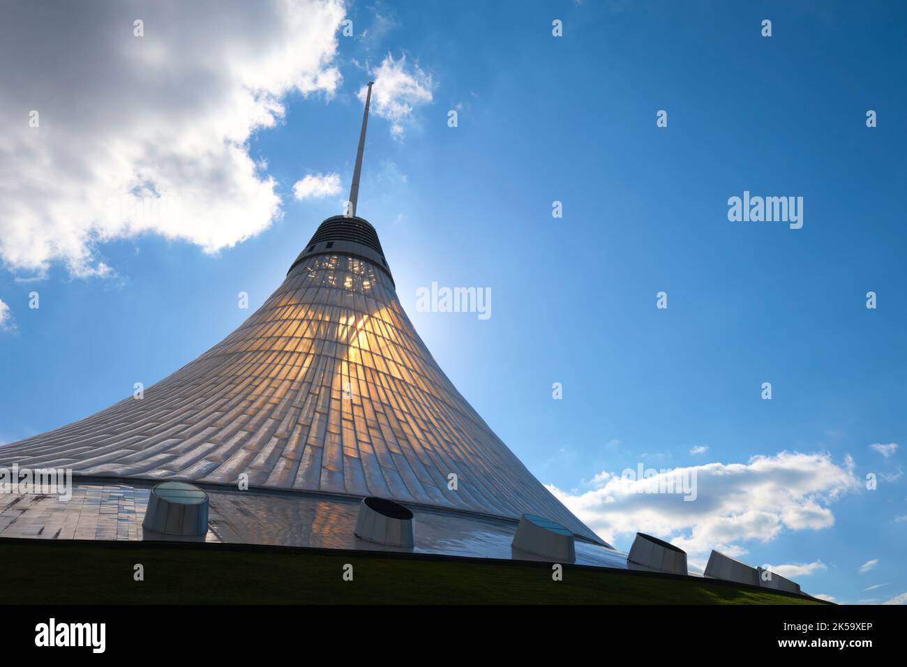 A backlit, exterior view of the Norman Foster design of the tent-like ...