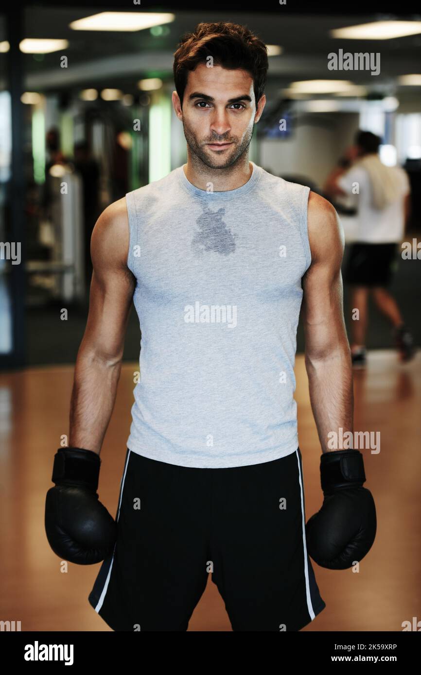 Hell take up the challenge. Portrait of a handsome sweaty man wearing ...