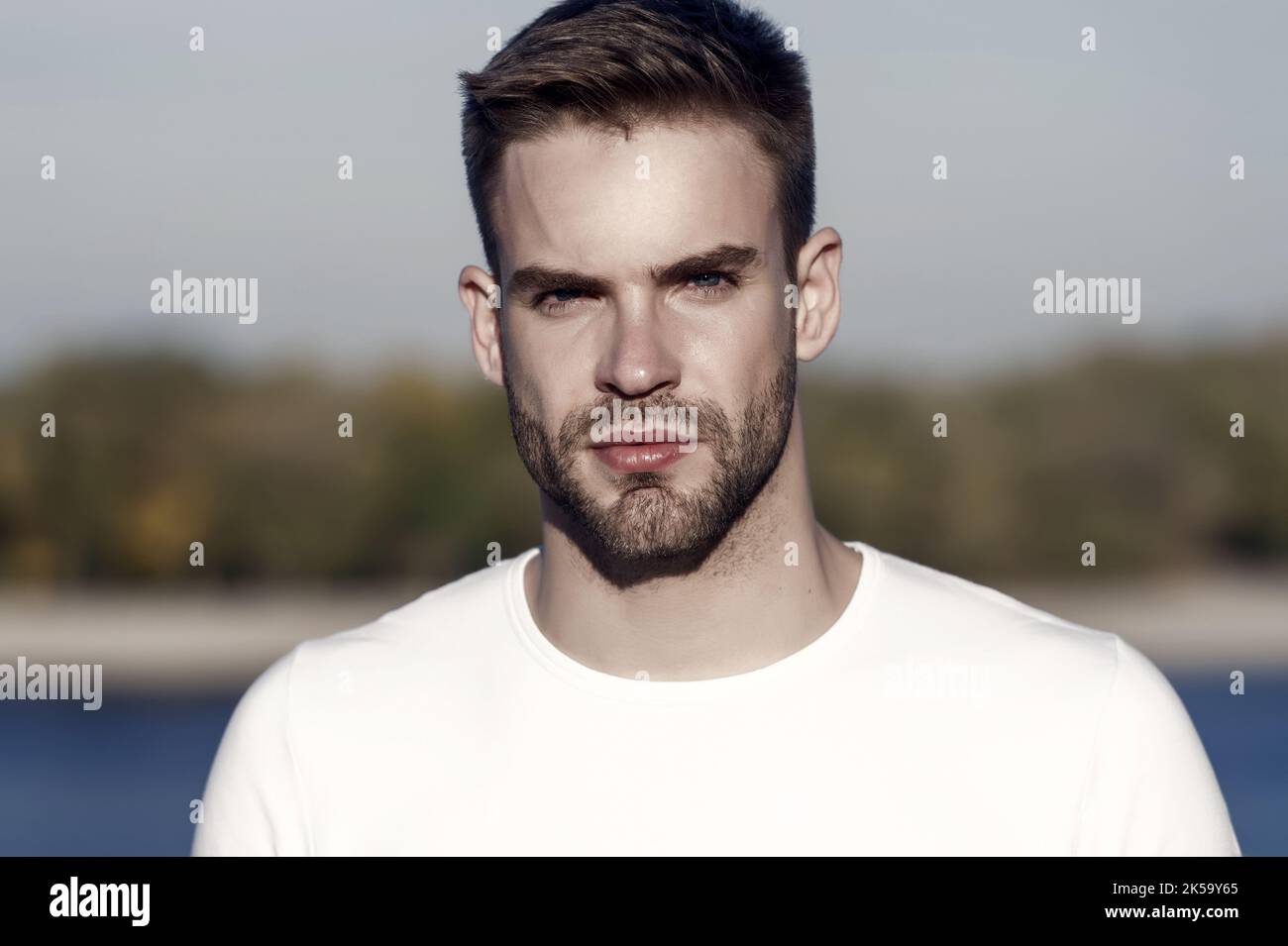 Preparing for sunny days. Handsome man outdoors. Summer skincare ...