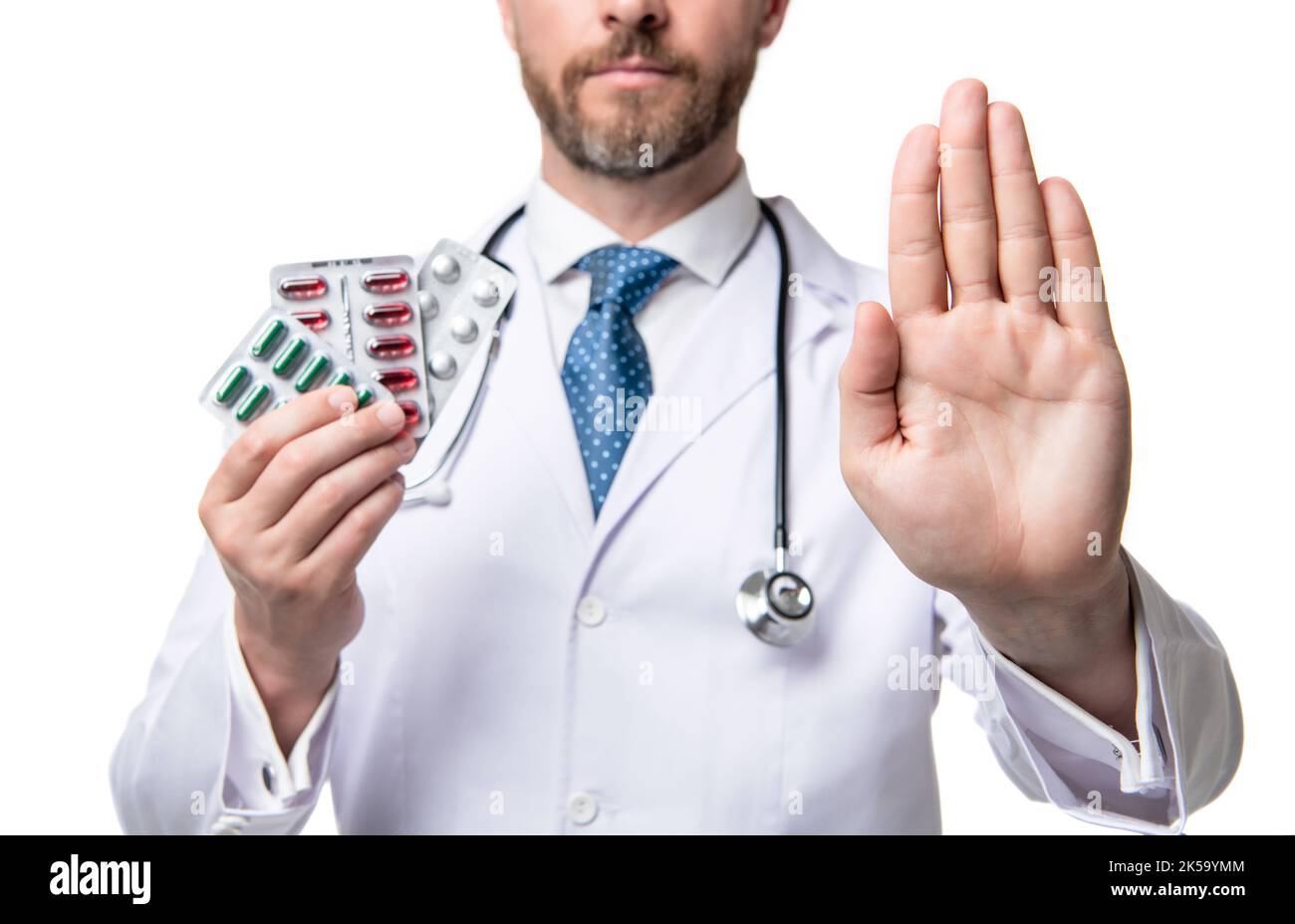 stop the stress. doctor hold pill with stop gesture. stop taking ...