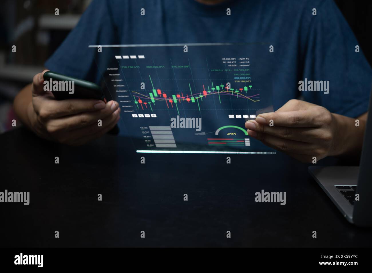 Businessman holding smartphone and virtual screen graph stock market ...