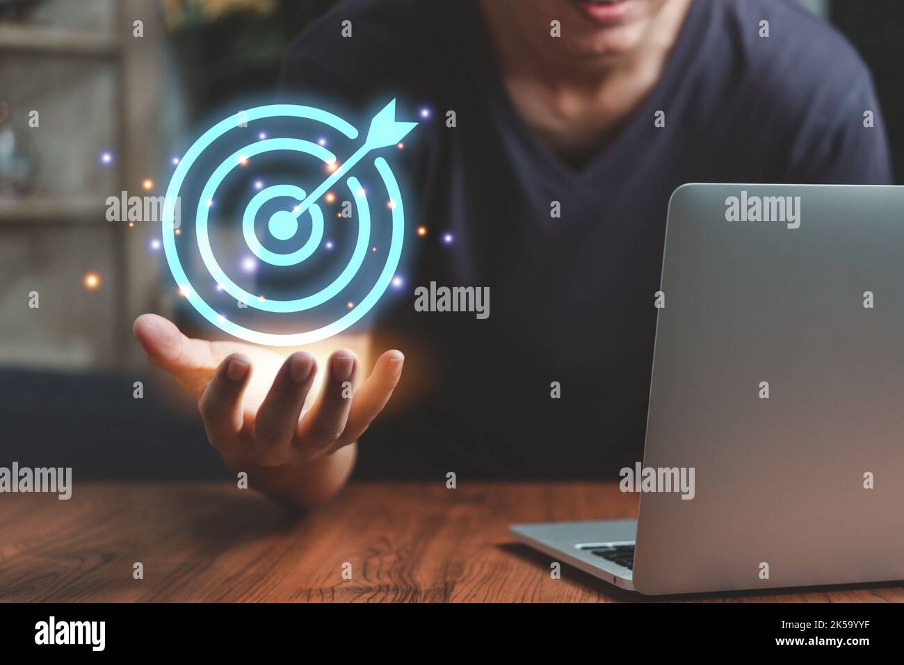 Businessman holding virtual target dart board.Business marketing ...